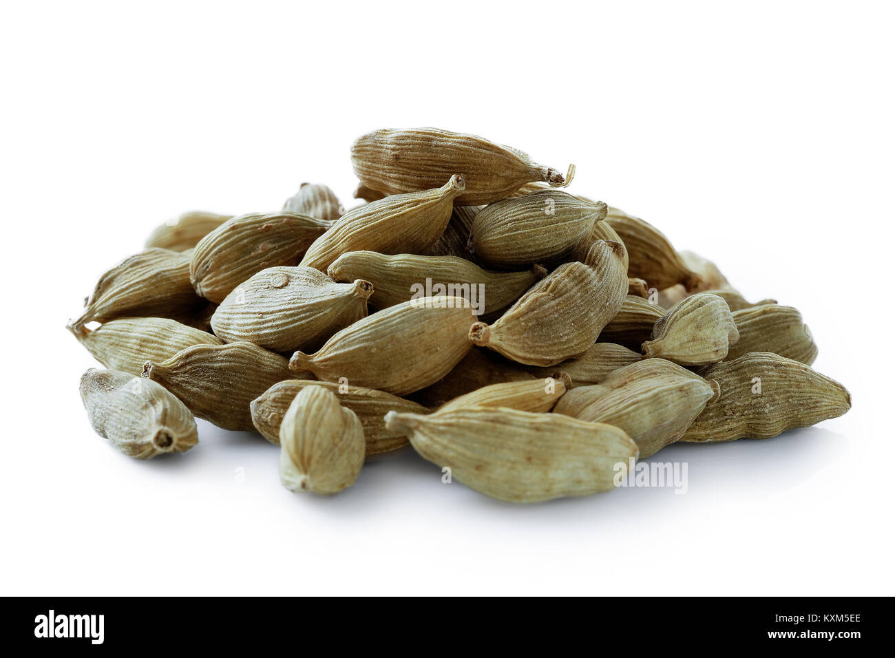 A pile of dry cardamom pods isolated on white Stock Photo - Alamy