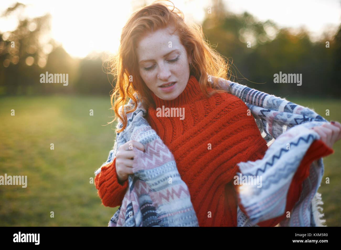 Woman wrapped in a blanket hi-res stock photography and images - Alamy