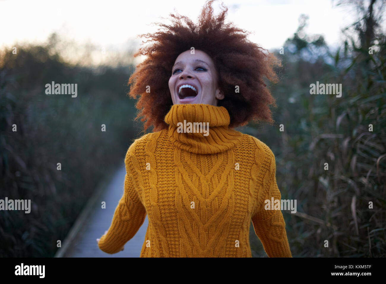 Portrait of young woman in rural setting,laughing Stock Photo - Alamy