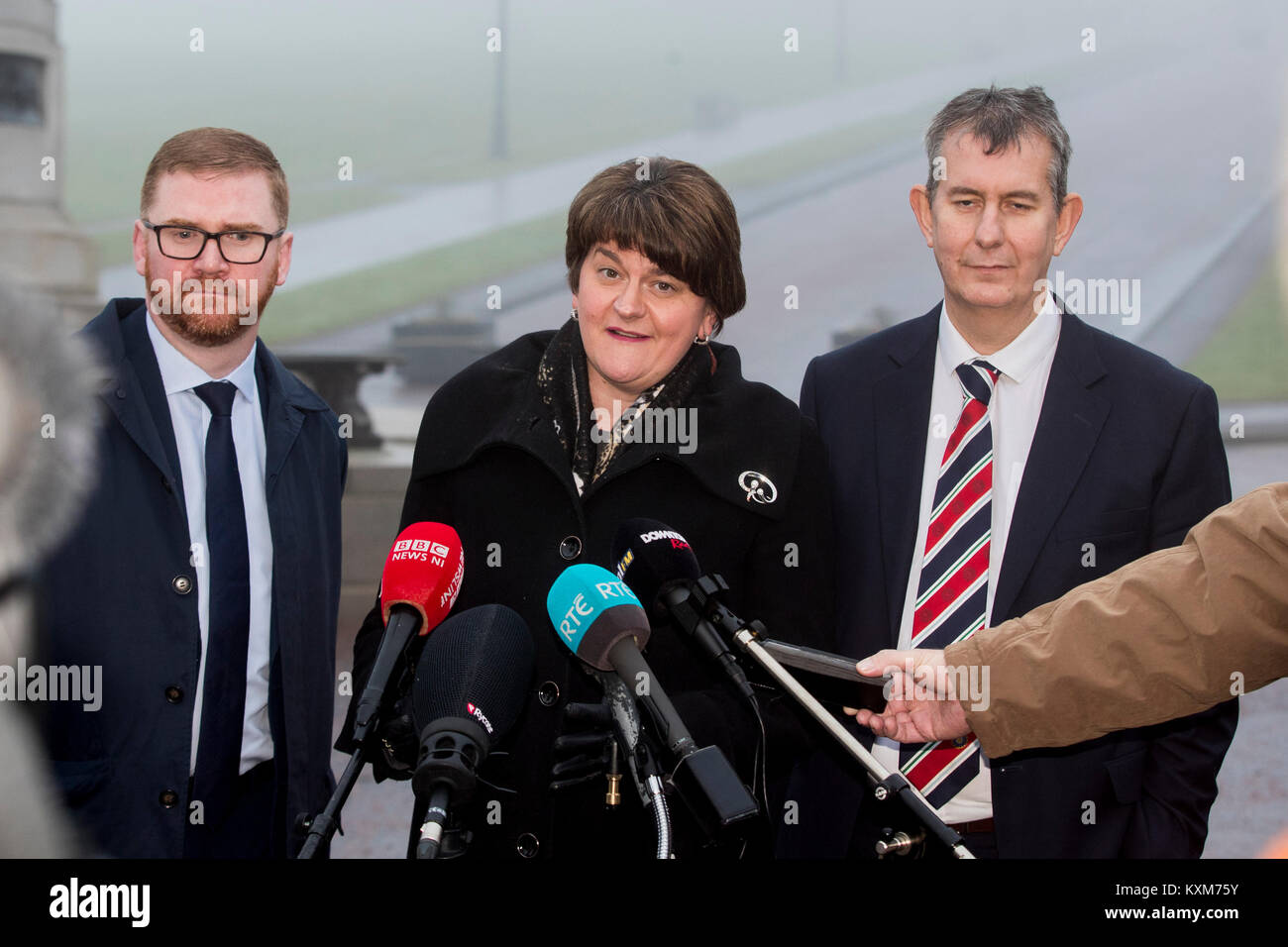 DUP leader Arlene Foster, with party colleagues Simon Hamilton and ...