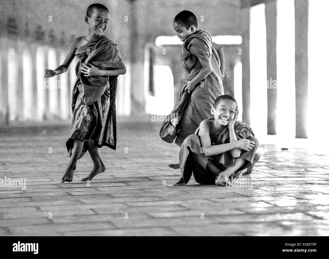 Novice Monks having fun in temple corridor, Bagan, Myanmar Stock Photo ...