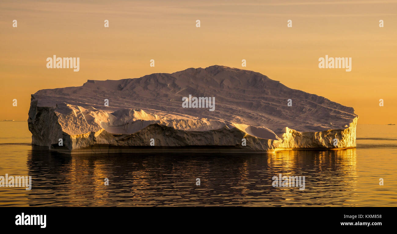 Iceberg during sunset Stock Photo - Alamy