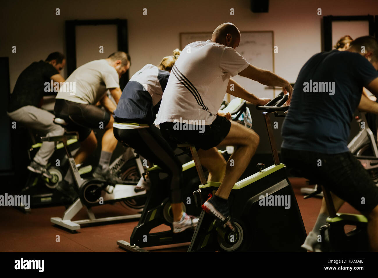 cycling class group. spin class workout Stock Photo - Alamy