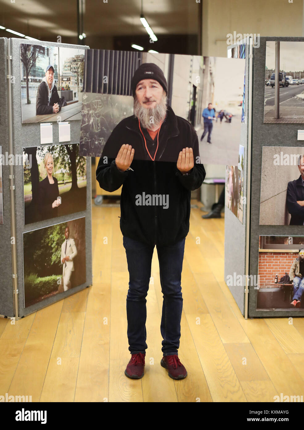 Photographer Peter Varga holding a print from his Humans of Dublin ...