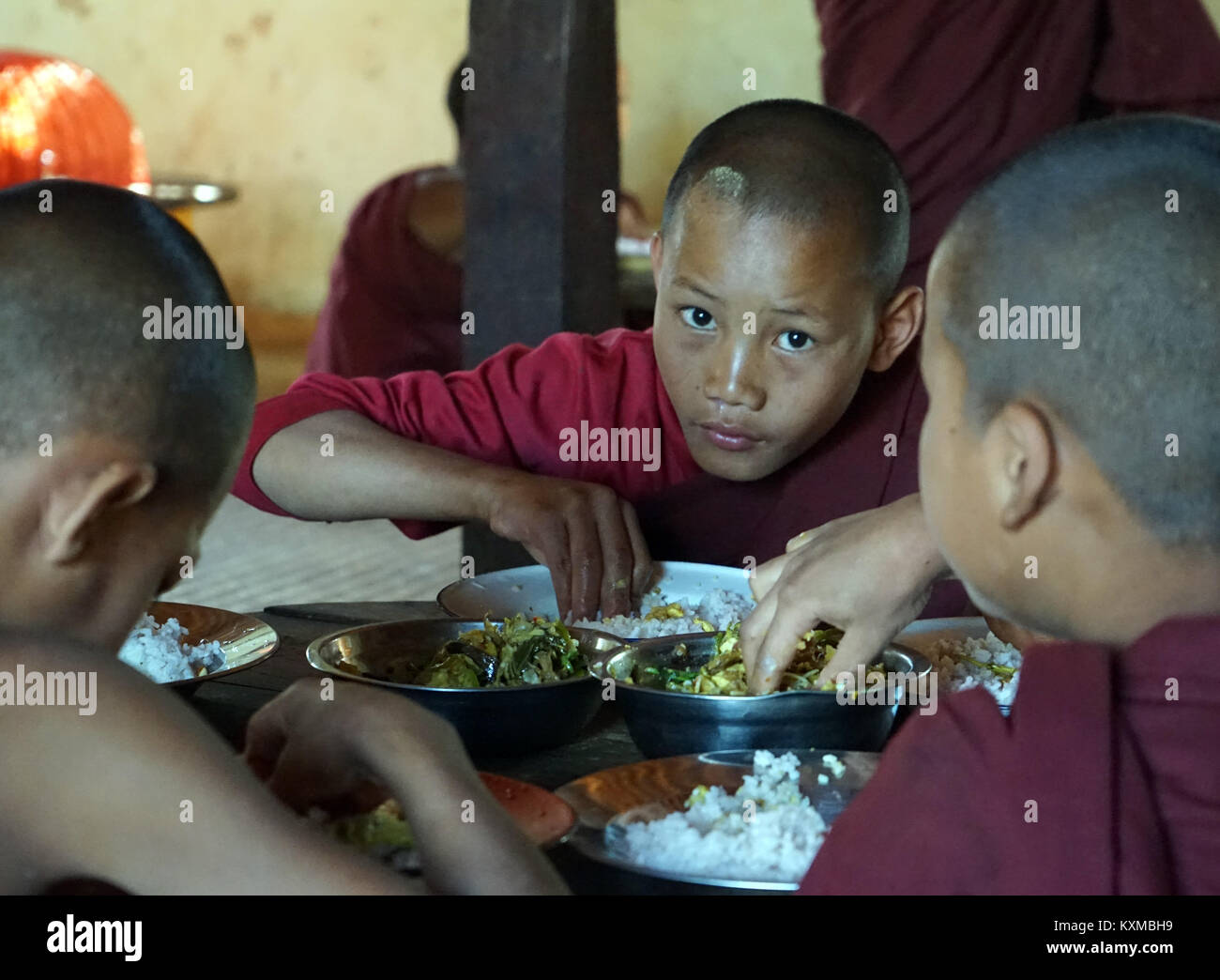 KALAW, MYANMAR - CIRCA APRIL 2017 Young monks near the table Stock ...