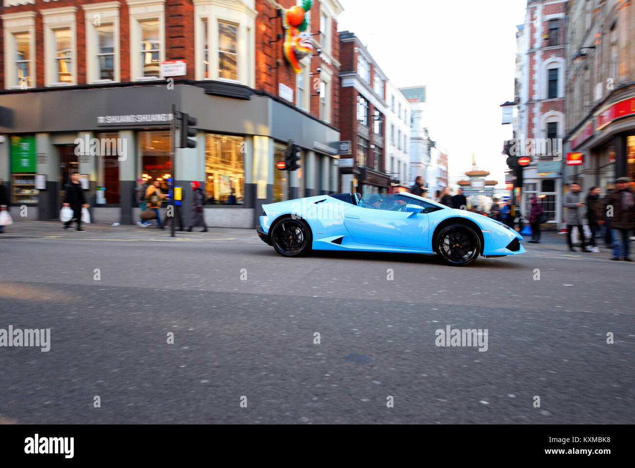 Lamborghini supercar driving through Shaftesbury Avenue, London at ...