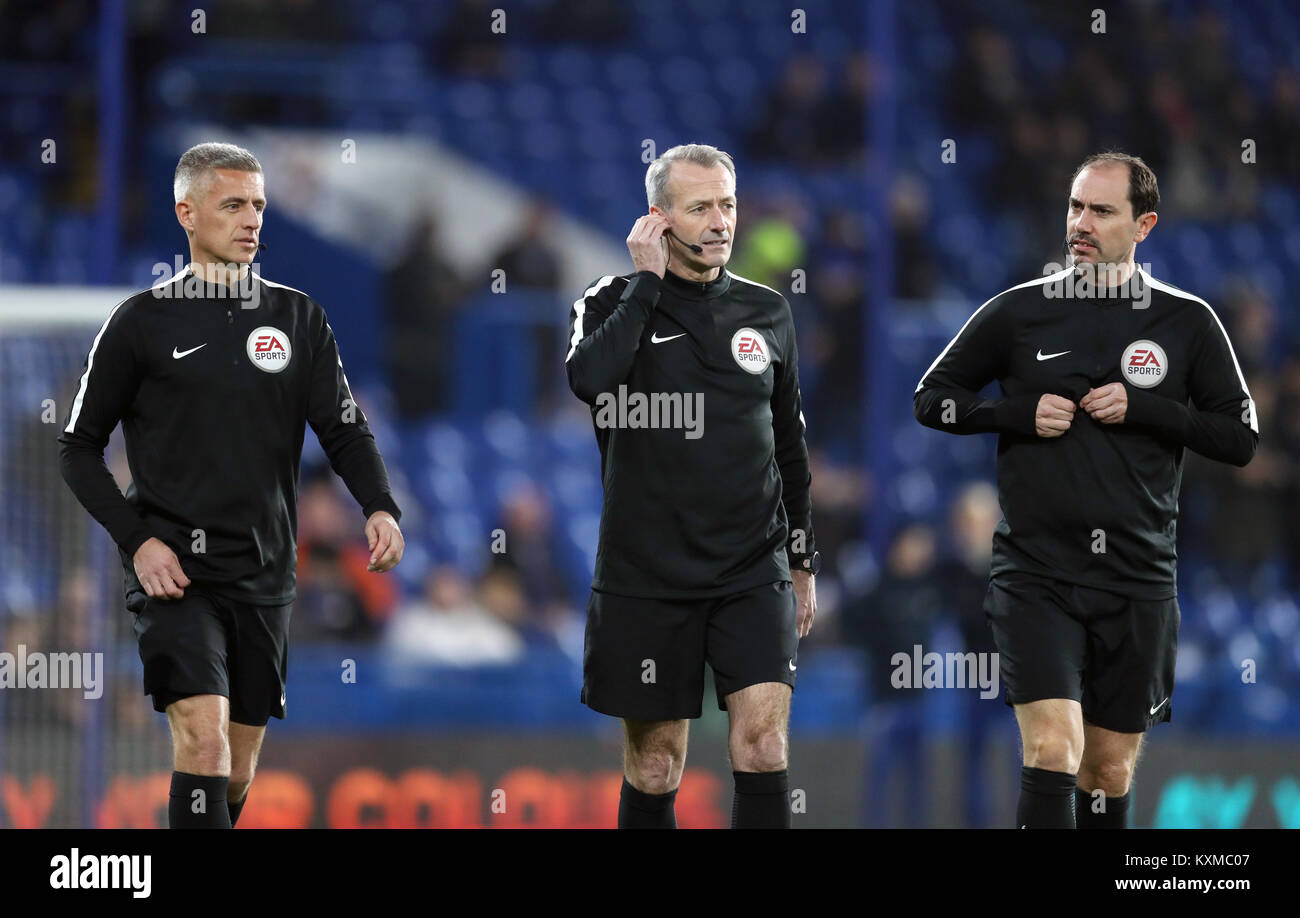 Referee Martin Atkinson (centre) and his officials warm up before the ...