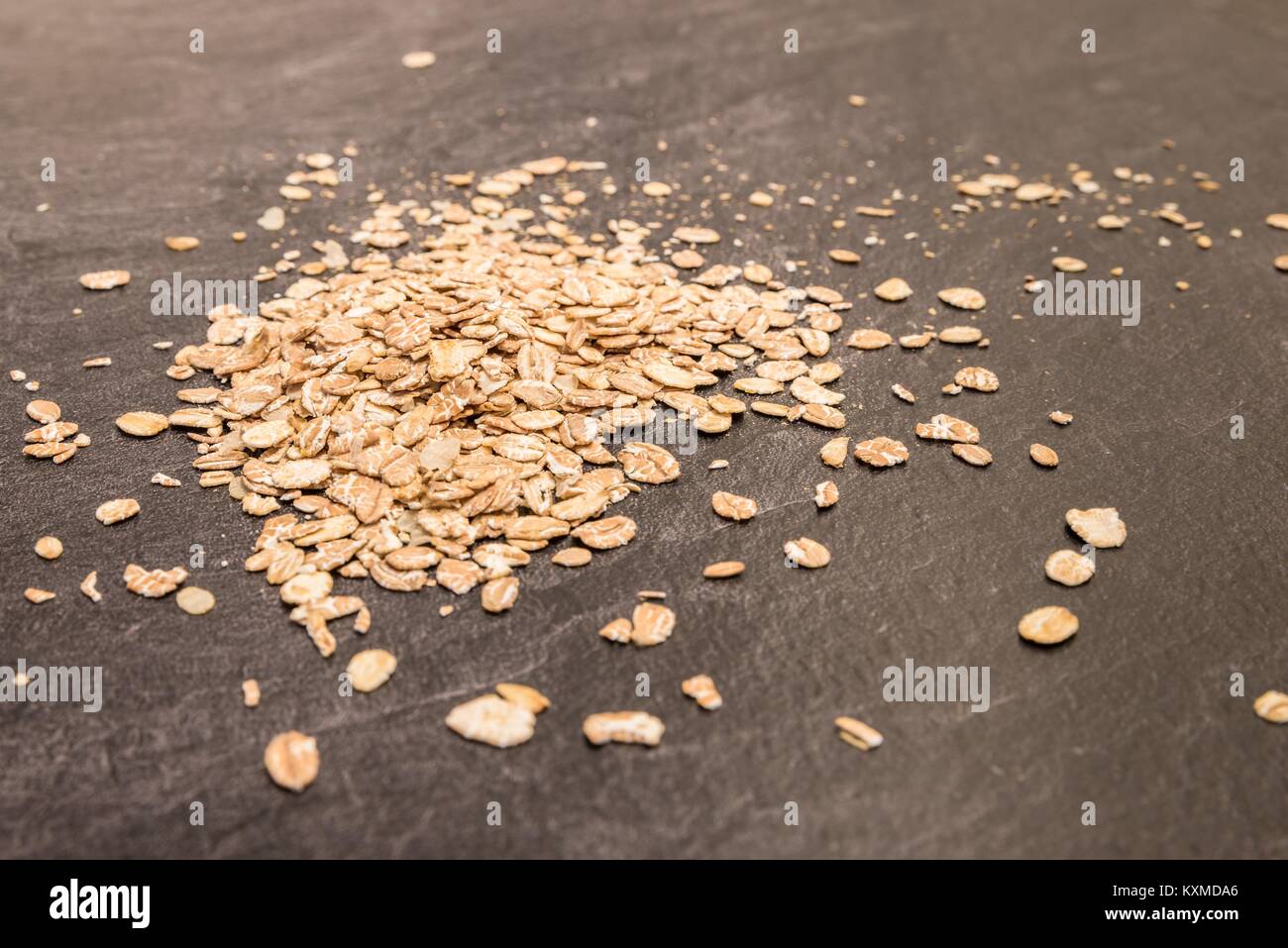 Cereal flakes on grey working surface Stock Photo - Alamy