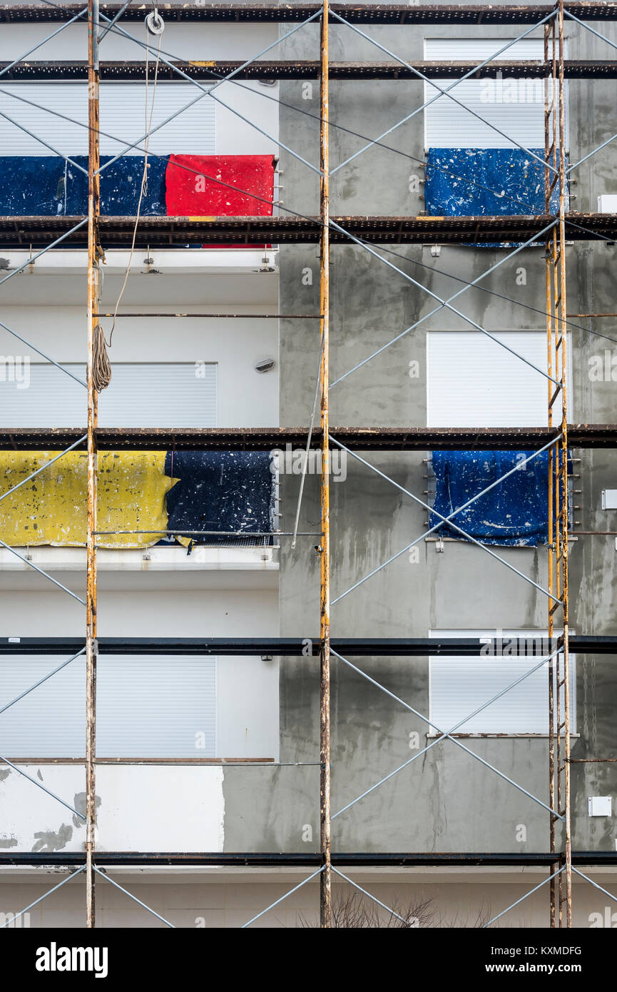 scaffolding on a construction site with graphic shapes and colours ...