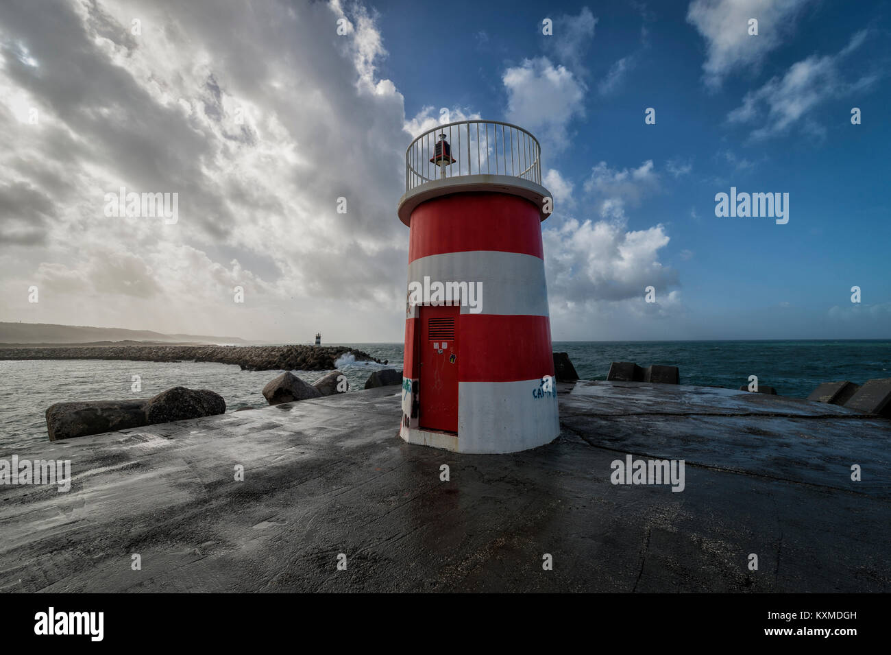 lighthouse at the entrance to Nazare harbour and marina, Portugal Stock ...