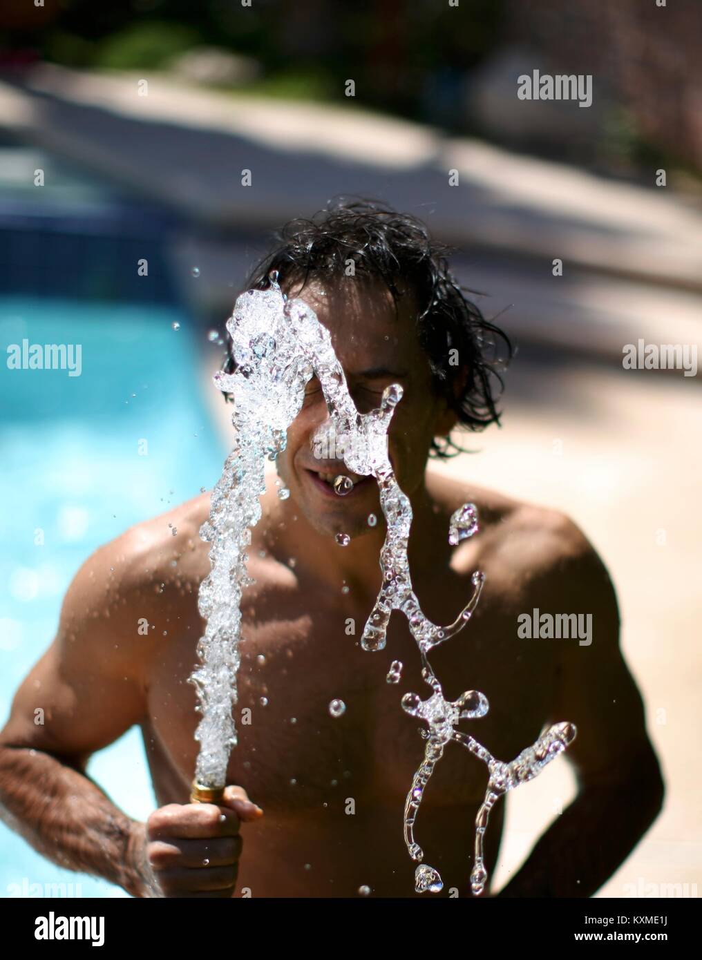 water spraying on a man Stock Photo - Alamy