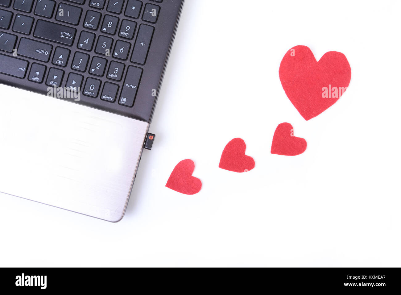 Red heart on laptop hi-res stock photography and images - Alamy