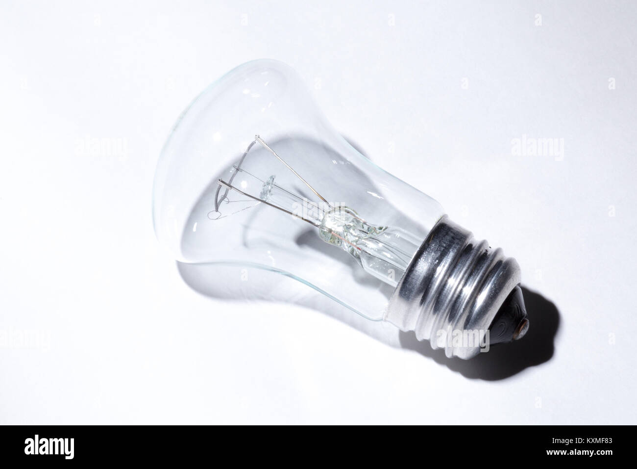 incandescent lamp, isolated on white background, in backlight Stock ...