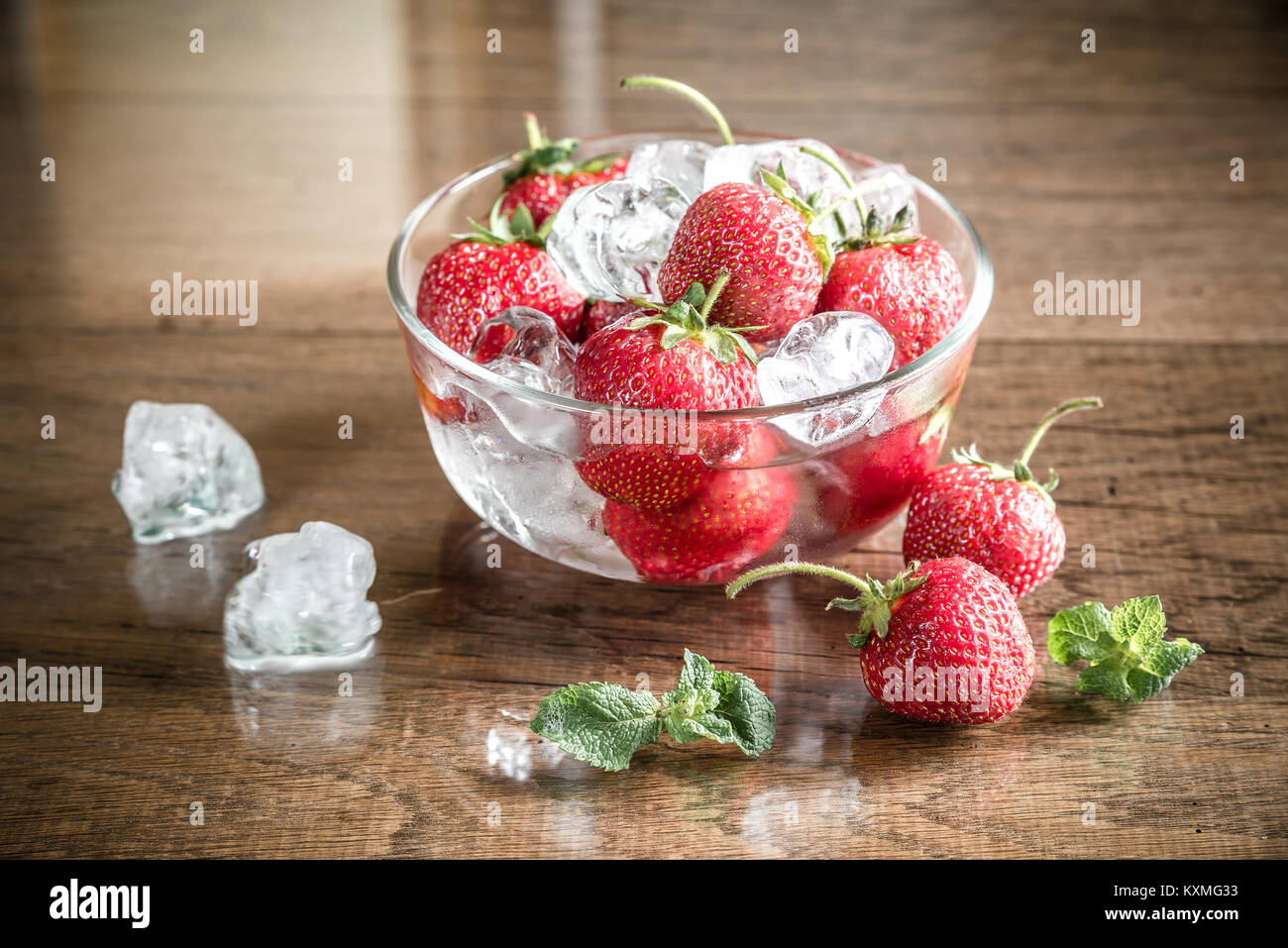 Fresh strawberries with ice cubes in the glass bowl Stock Photo - Alamy