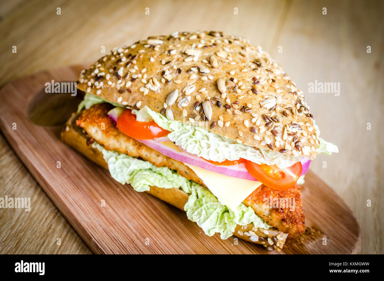 Triangle wholewheat-bun hamburger Stock Photo - Alamy
