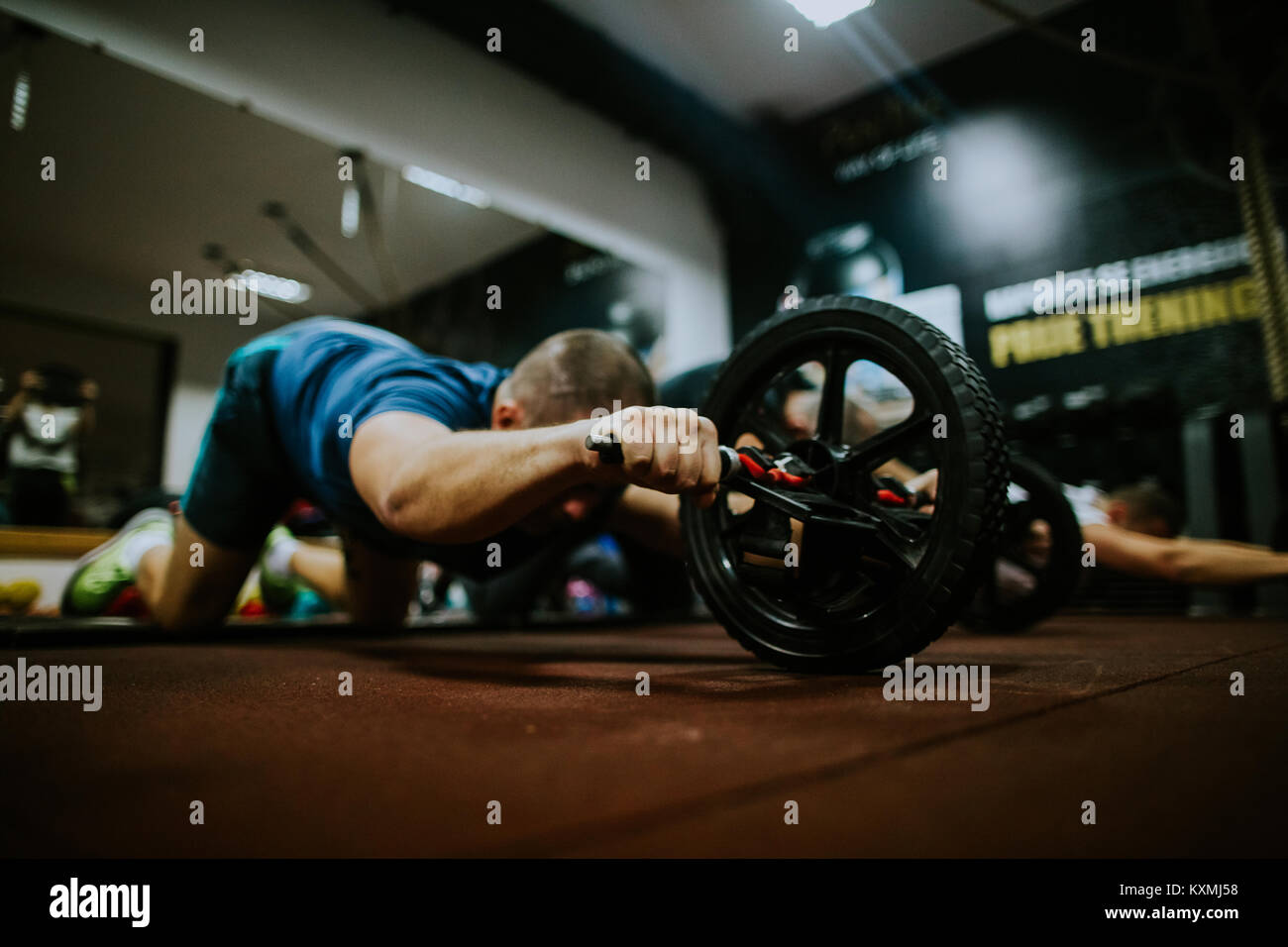 Crossfit wheel Ab Roller workoutp. Group training workout Stock Photo ...