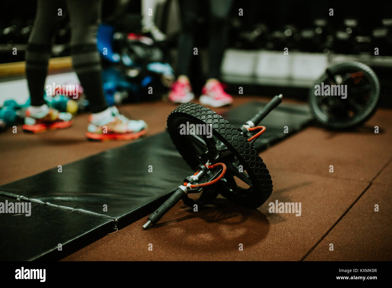Crossfit Wheel Ab Roller indoors Stock Photo - Alamy