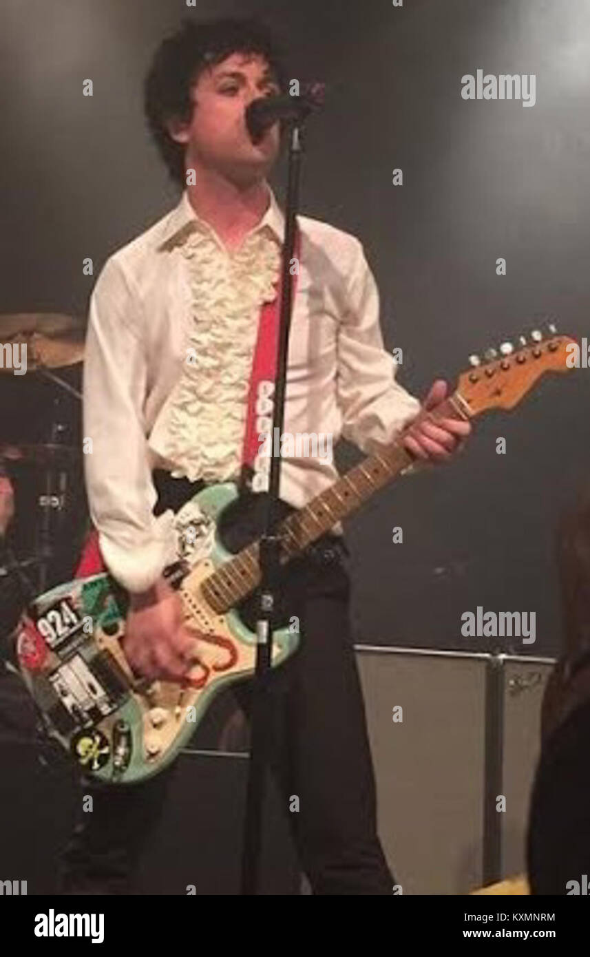 This image captures Billie Joe Armstrong, lead singer of Green Day ...