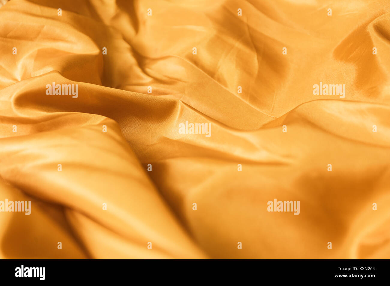 Orange wrinkled fabric cloth background, close Stock Photo - Alamy