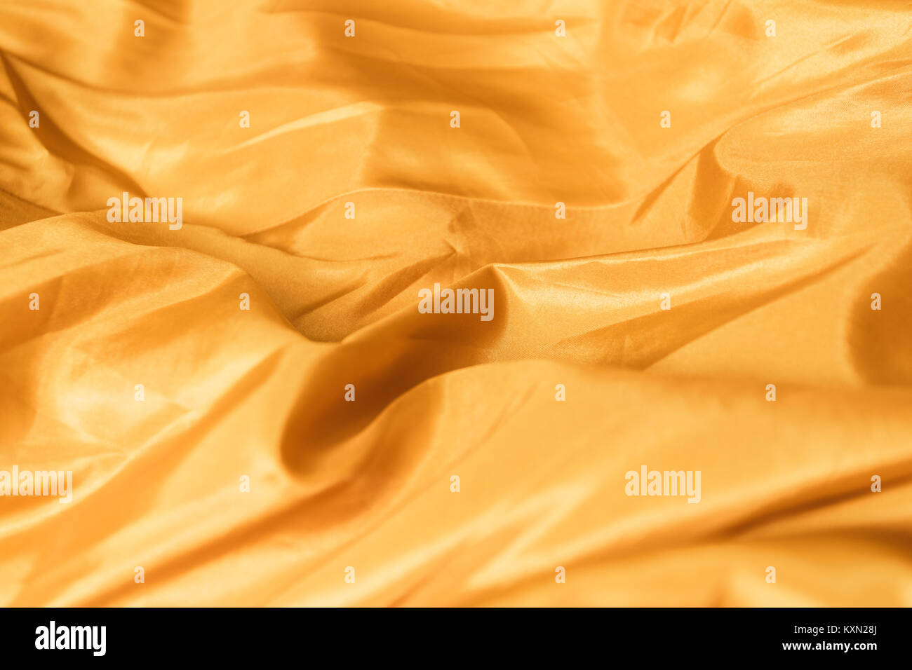 Orange wrinkled fabric cloth background, close Stock Photo - Alamy