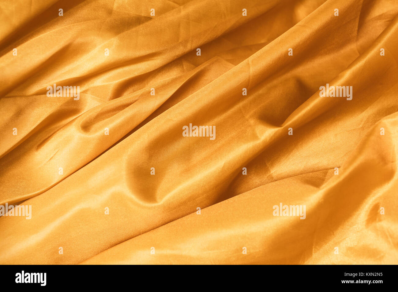 Orange wrinkled fabric cloth background, close Stock Photo - Alamy