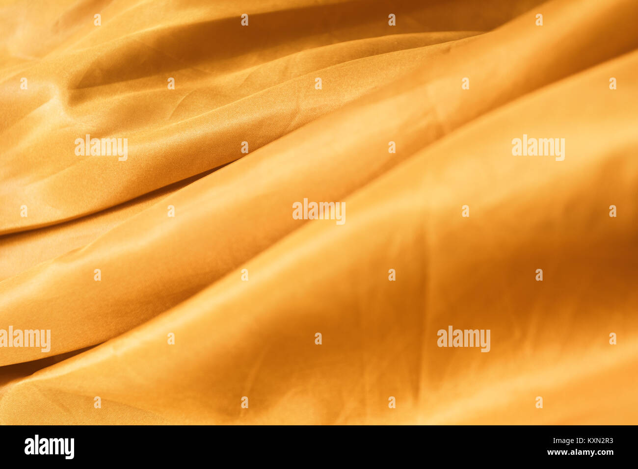 Orange wrinkled fabric cloth background, close Stock Photo - Alamy