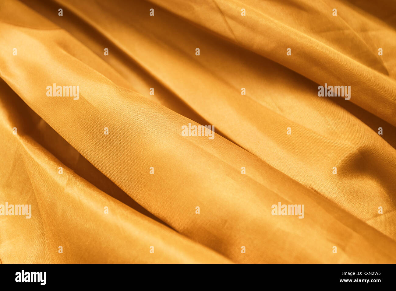 Orange wrinkled fabric cloth background, close Stock Photo - Alamy