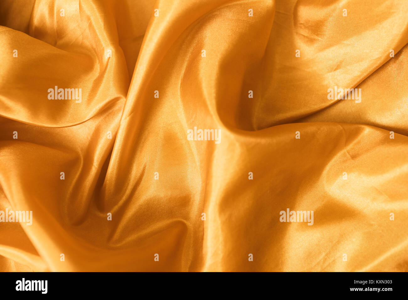 Orange wrinkled fabric cloth background, close Stock Photo - Alamy