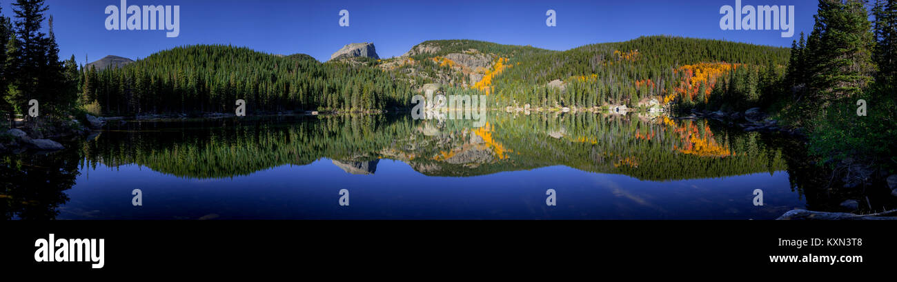 Mountains and trees in fall colors reflecting in lake, Bear Lake, Rocky ...