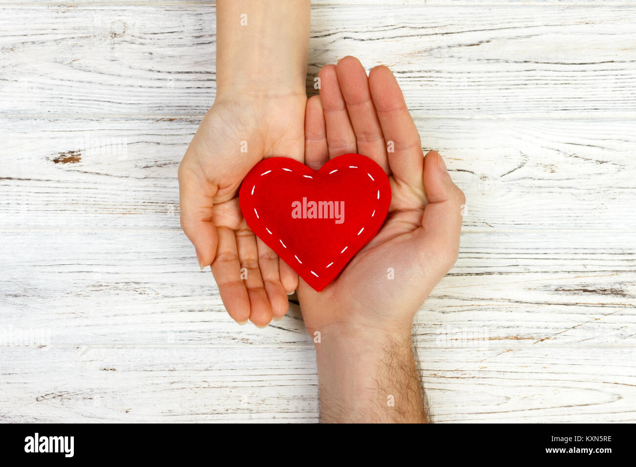 Hand offering heart symbol hi-res stock photography and images - Alamy