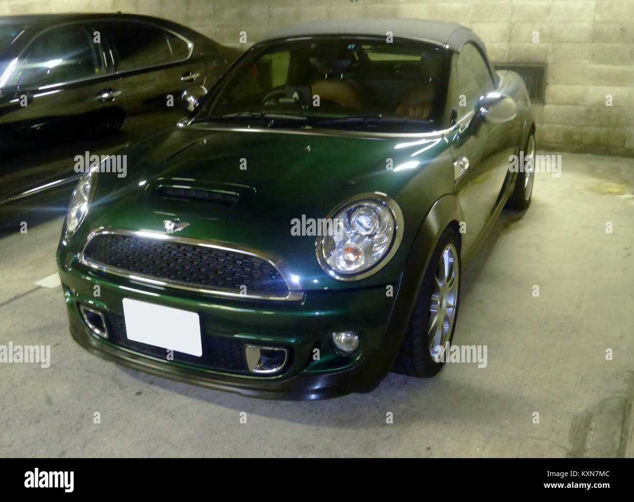 This image shows the front view of a BMW MINI Cooper S Coupé (R58), a ...