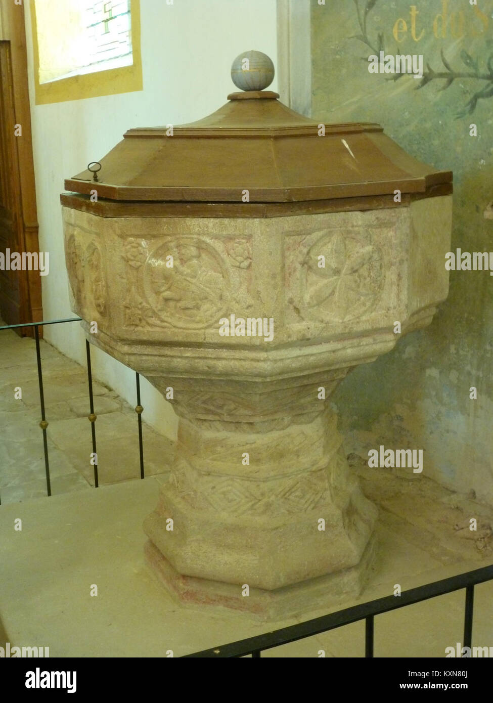 Baptismal font at the Church of Notre-Dame de Champ-le-Duc, France ...