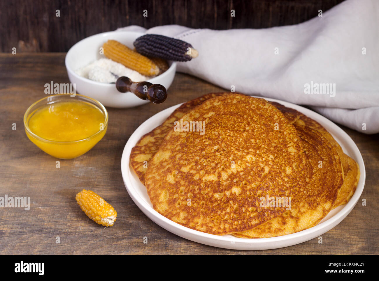 Coconut corn pancakes with honey. Rustic style Stock Photo - Alamy