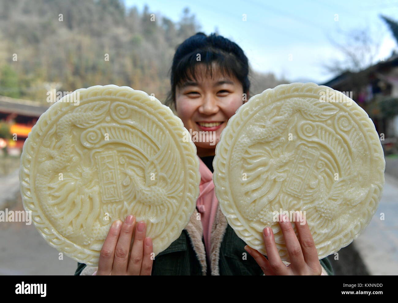 Enshi, China's Hubei Province. 11th Jan, 2018. A woman shows Ciba, or ...