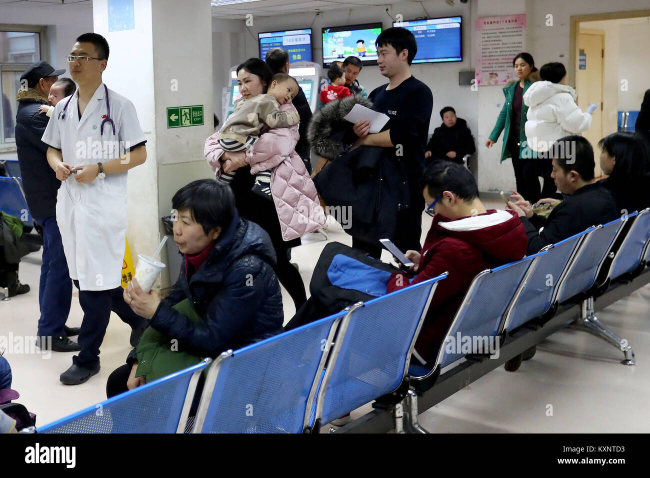 Beijing, China. Jan. 11, 2018 (Children and their parents wait for ...