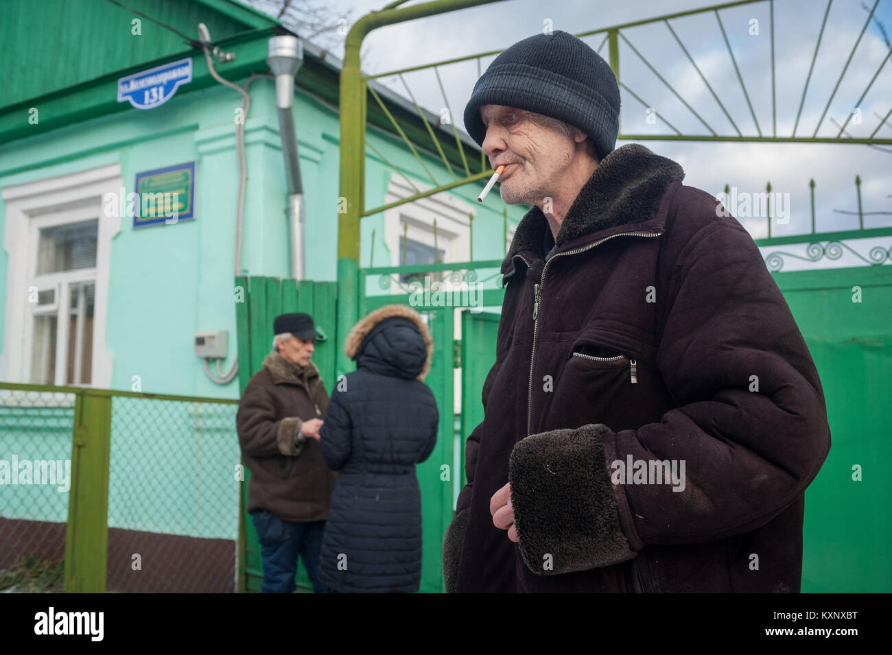 Homeless man smoking cigarette near hi-res stock photography and images ...
