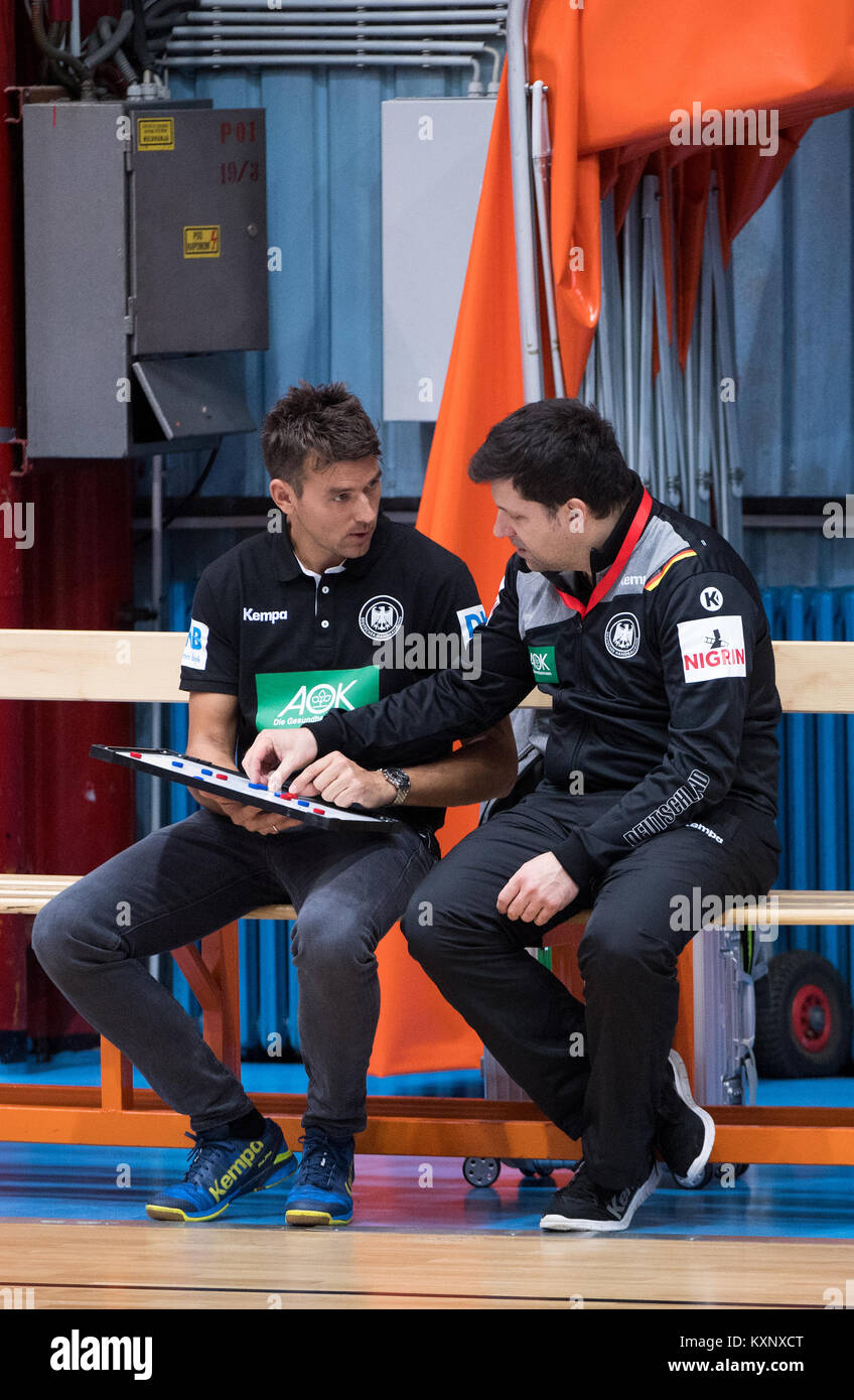 Zagreb, Croatia. 11th Jan, 2018. German trainer Christian Prokop (M) and co-trainer Alexander ...