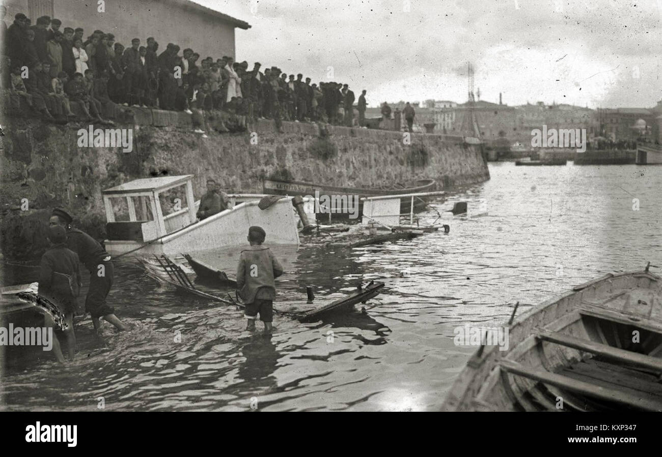 Wrecked boats in the port of San Sebastián, Spain, showing maritime ...