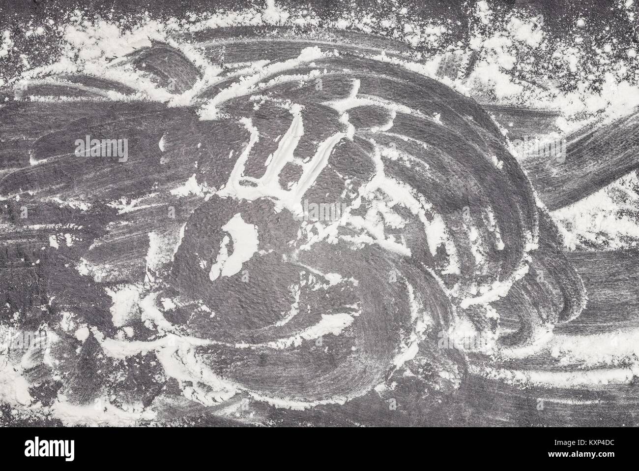 Wheat flour on grey working surface wiped away Stock Photo - Alamy