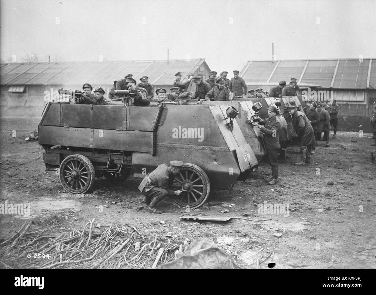 Members of the Canadian Motor Machine Gun Brigade cleaning armored cars ...