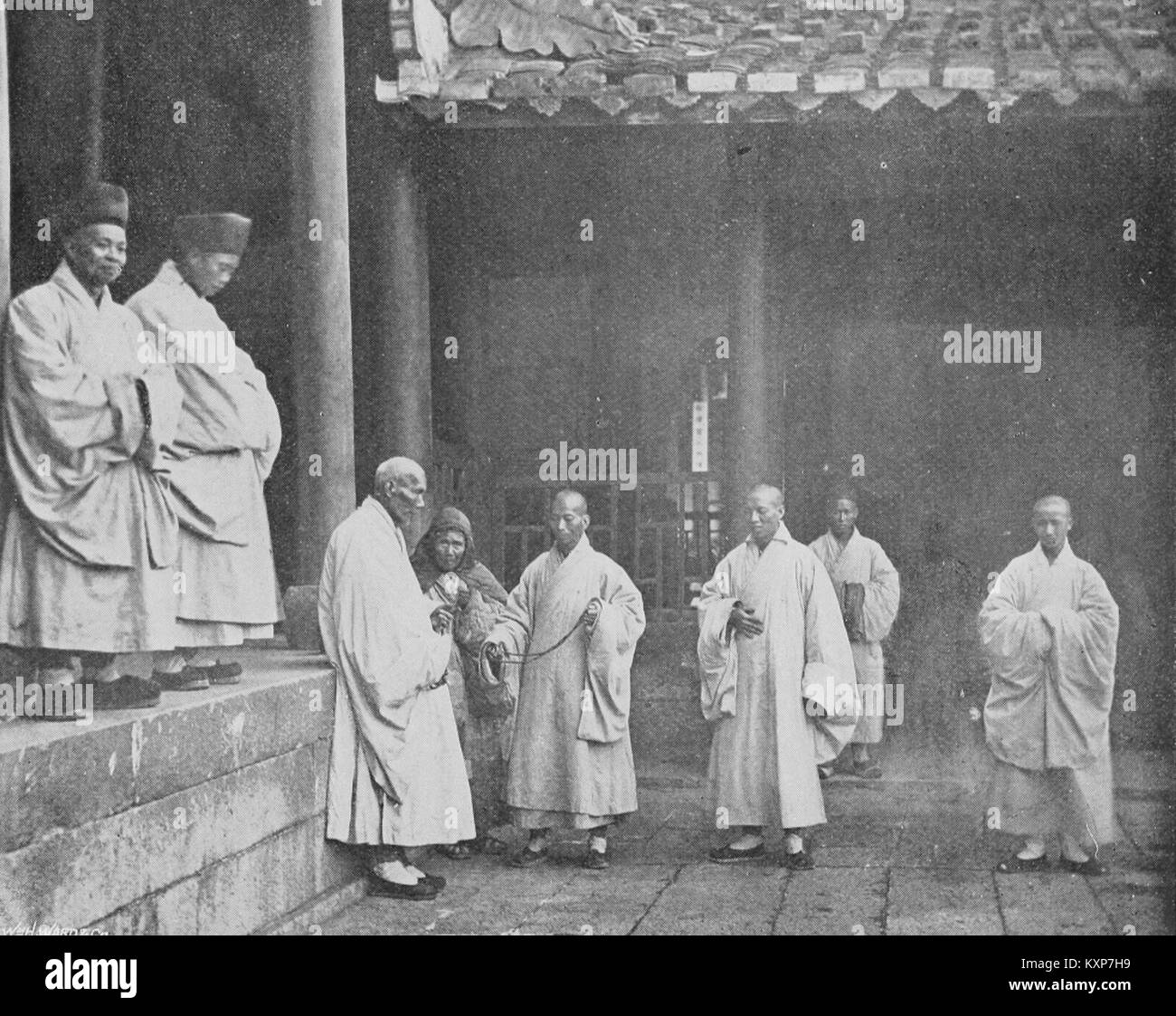 John Thomson's photograph 'Buddhist Monks' captures a group of monks ...