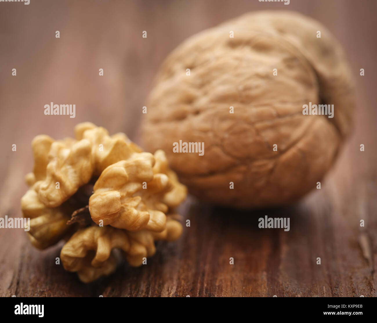 Some walnut closeup in natural surface Stock Photo - Alamy