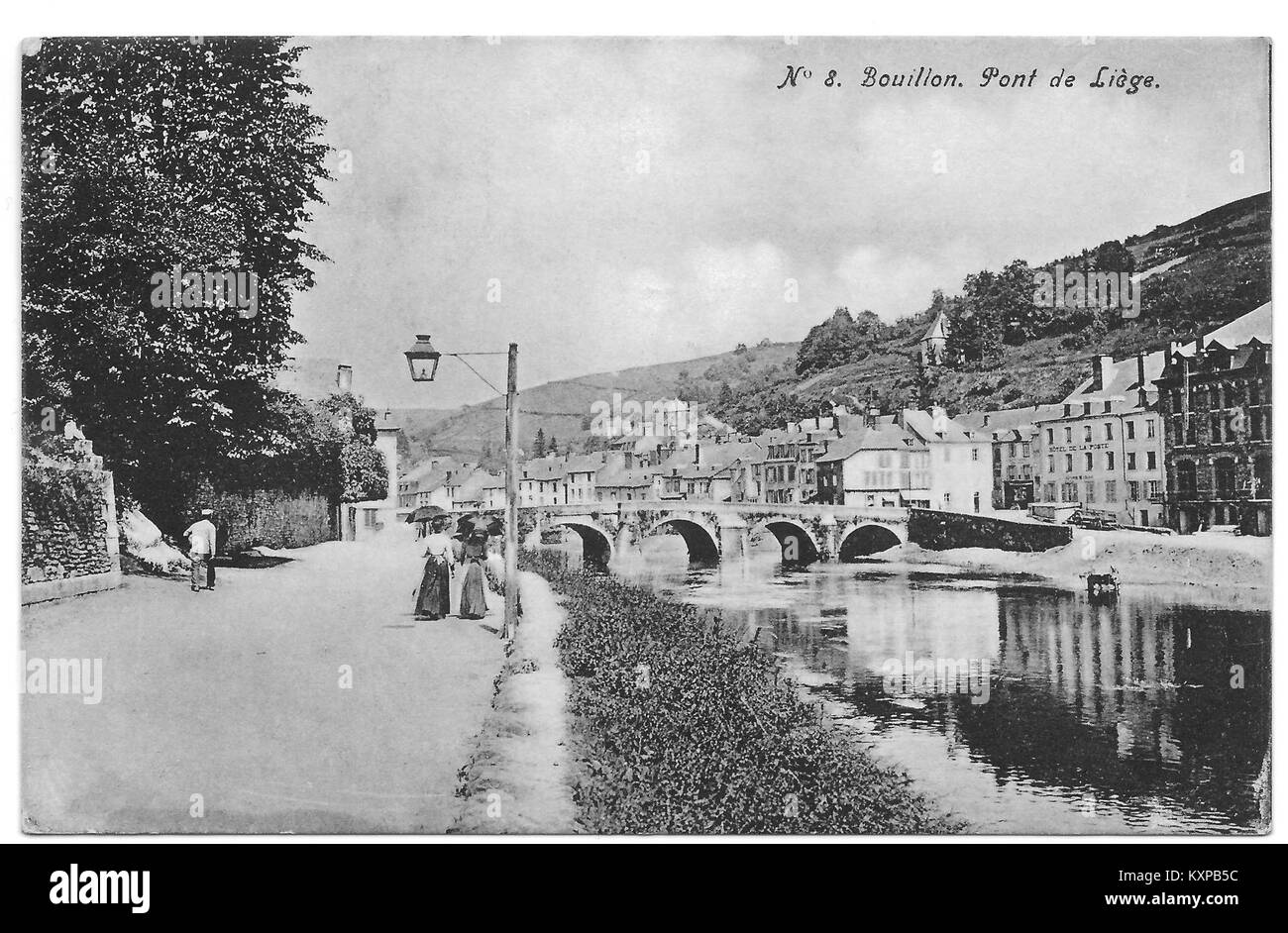 The Pont de Liège in Bouillon is a historical bridge that spans a river ...
