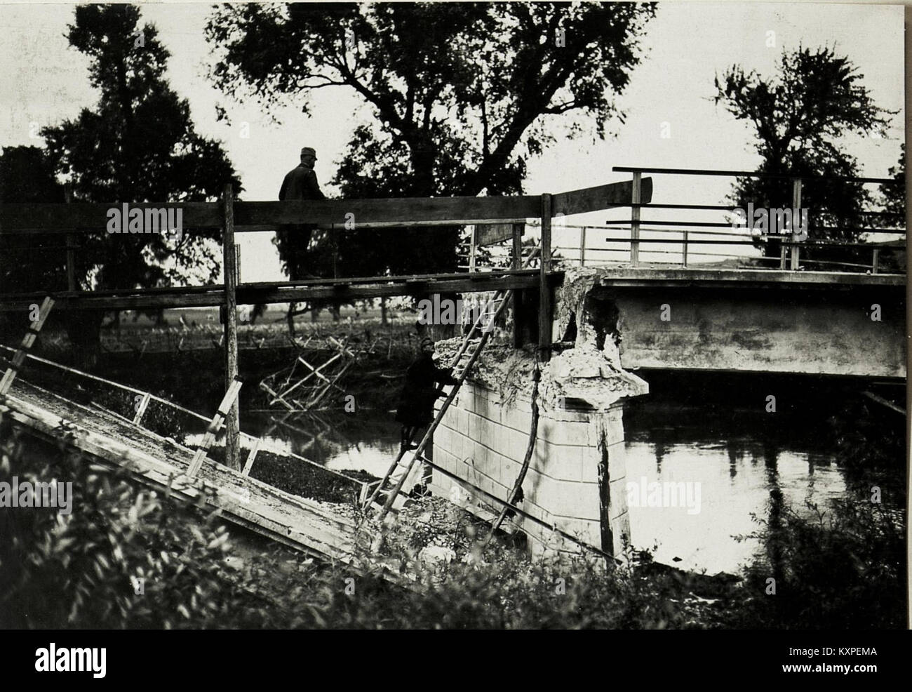 This image shows the destroyed reinforced concrete bridge over the ...