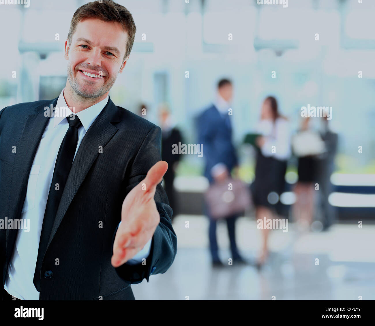 Portrait of a successful businessman giving a hand Stock Photo - Alamy