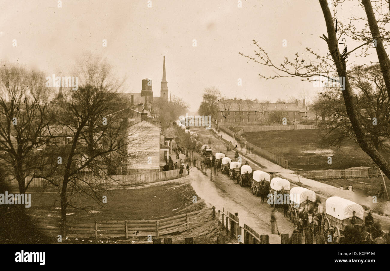 The first Federal wagon train entering the town Stock Photo - Alamy
