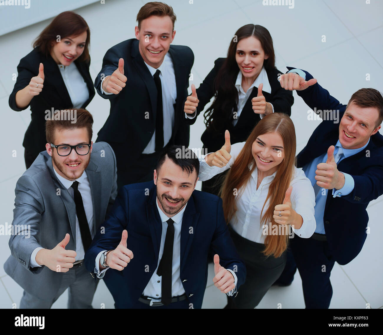 Top view of executives smiling and pointing Stock Photo - Alamy