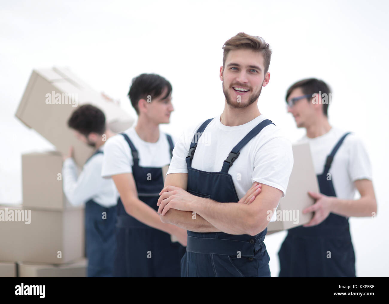 Workers unload boxes Stock Photo - Alamy