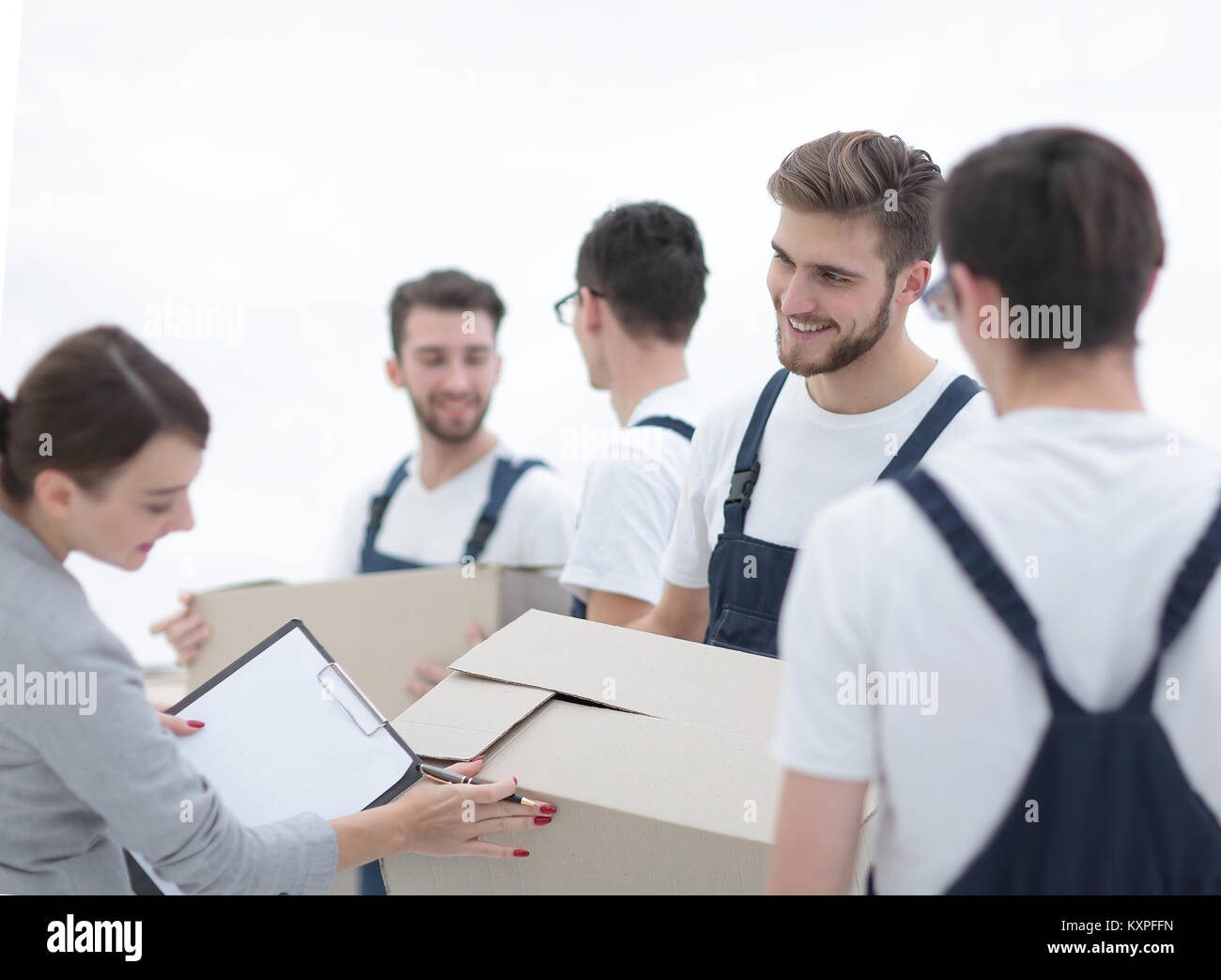 Manager and movers isolated on white background Stock Photo - Alamy