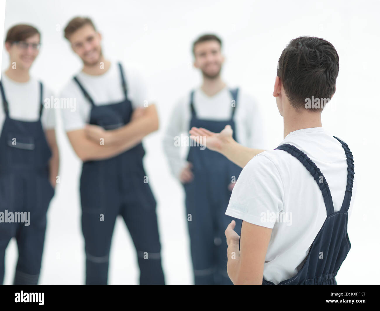 cheerful team of responsible movers and their smiling leader Stock ...